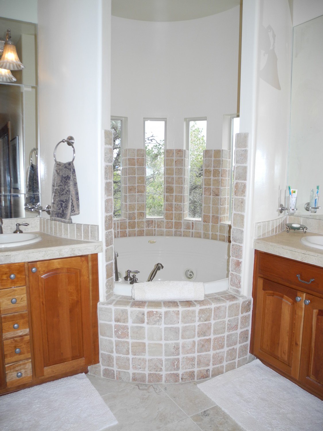 spa-round-jetted-soaking-tub-accented-travertine-tile - Lee Michael ...